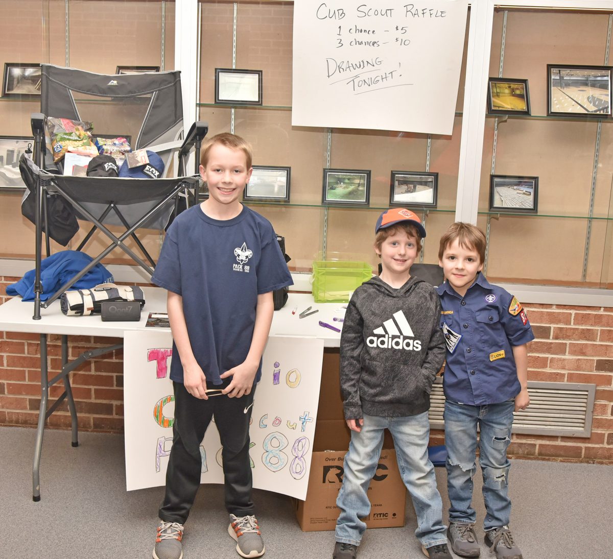 Cub Scouts hand out a big prize - Farmer Publishing