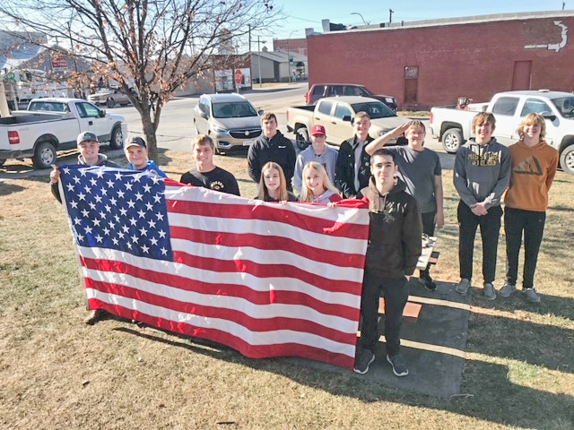 Volunteers help with flags